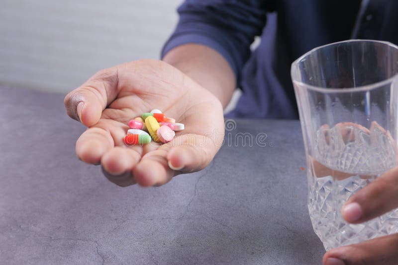 Close Up of Man Hand Taking Medicine Stock Photo - Image of painkiller ...