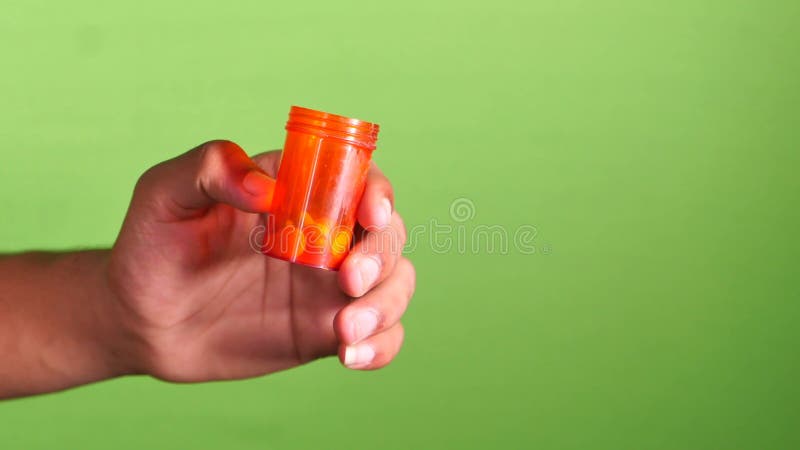 Close Up of Man Hand Holding Pill Container on Green Screen Stock ...