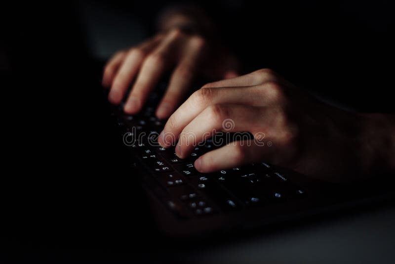 Close Up Man Hand Typing Keyboard on Laptop in Darkness Operating Room ...