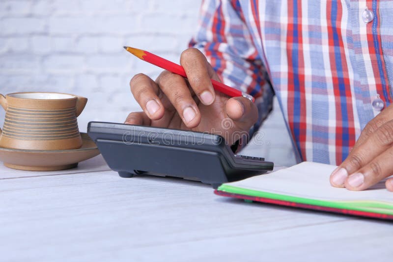 Close Up of Man Hand Using Calculator Stock Photo - Image of calculator ...