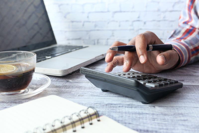Man Hand Using Calculator and Laptop on Office Desk Stock Image - Image ...
