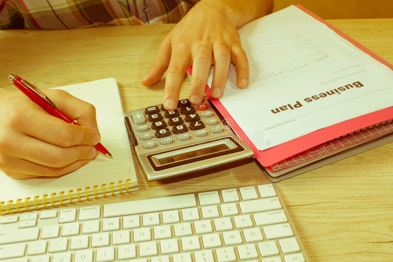 Close Up Man Hand Using Calculator and Writing Make Note with Ca Stock ...