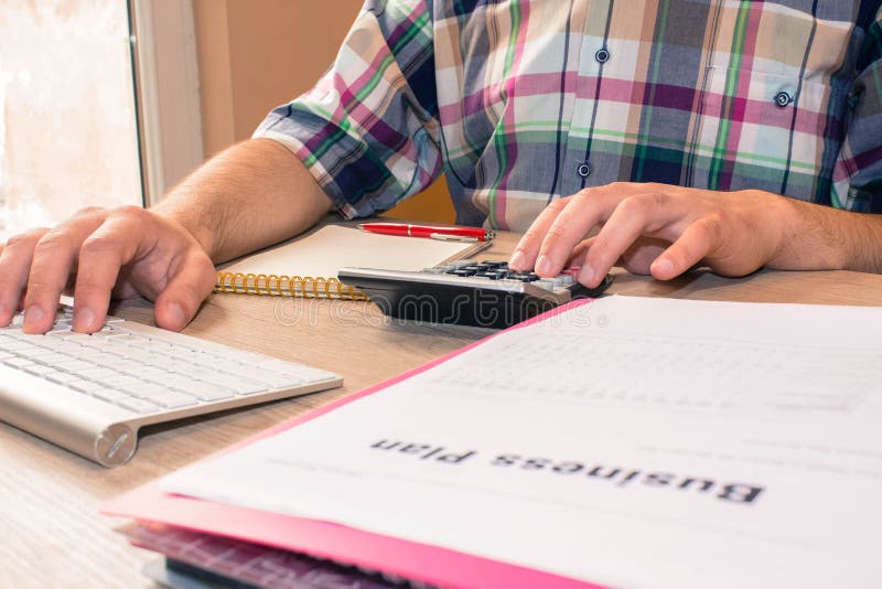 Close Up Man Hand Using Calculator and Writing Make Note with Ca Stock ...