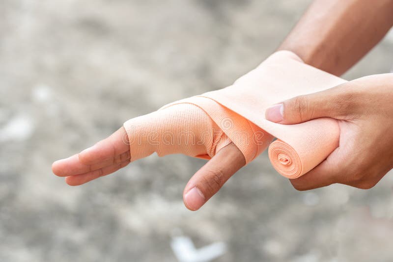 Close-up of a Man Hand Wrapping Elastic Bandage. Wounded Hand Cover ...