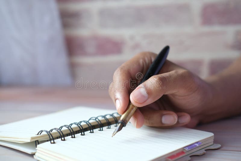 Close Up of Man Hand Writing on Notepad. Stock Image - Image of ...