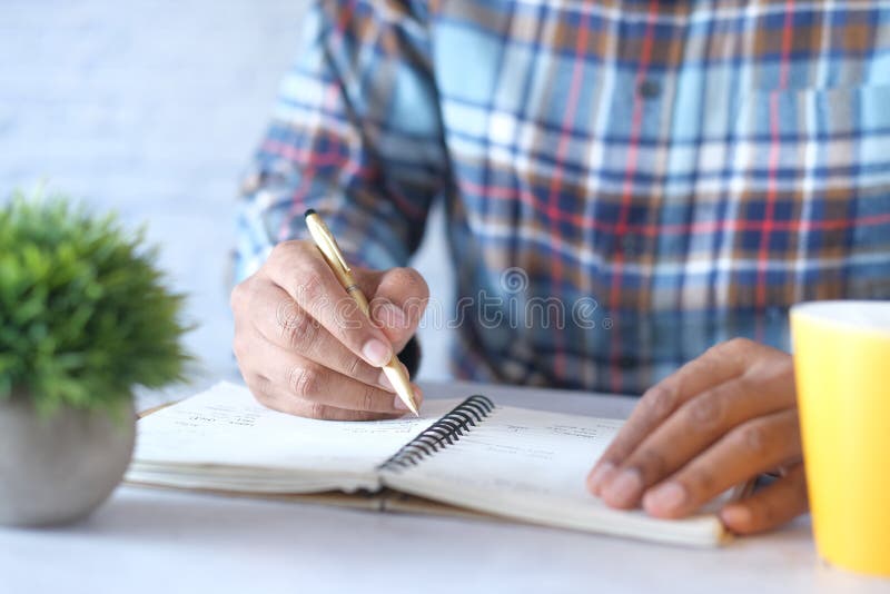 Close Up of Man Hand Writing on Notepad. Stock Image - Image of ...