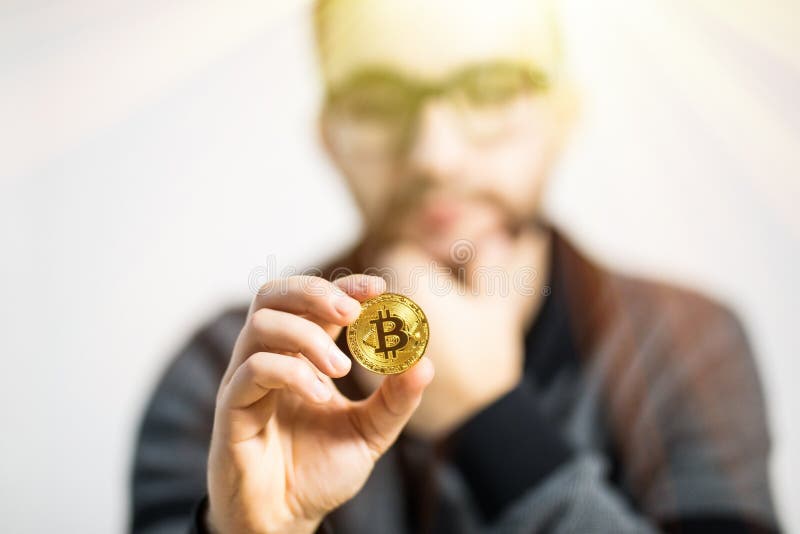 Close Up of Man Hands with Bitcoin with Thinking Man Face on Background ...
