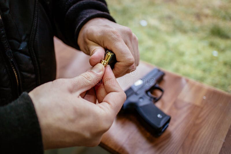 Loading Gun stock photo. Image of magazine, focus, weapon - 100209426