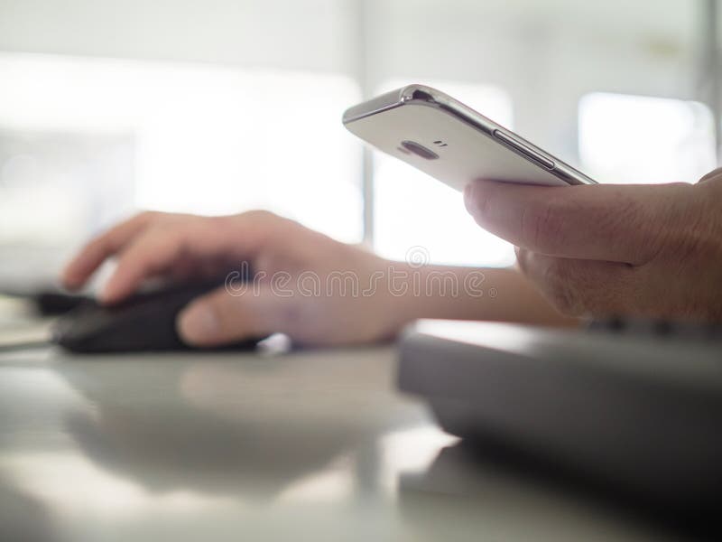 Man Hands Holding and Working with Mobile Phone and Computer Stock ...