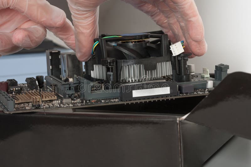 Close Up of Man Hands Installing CPU Cooler Fan on New, Modern Stock ... Close Up of Man Hands Installing CPU Cooler Fan on New, Modern Stock ...