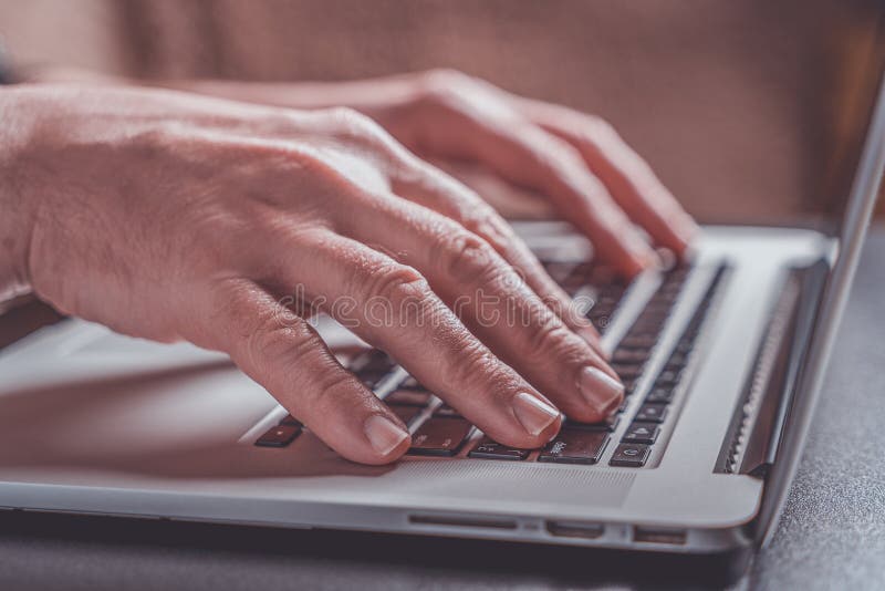 Close-up of Man Hands and Laptop Keyboard. Man Working or Playing on a ... Close-up of Man Hands and Laptop Keyboard. Man Working or Playing on a ...