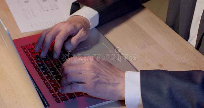 Close-up of a Man S Hands Typing Text on Laptop Keyboard. he Makes an ...