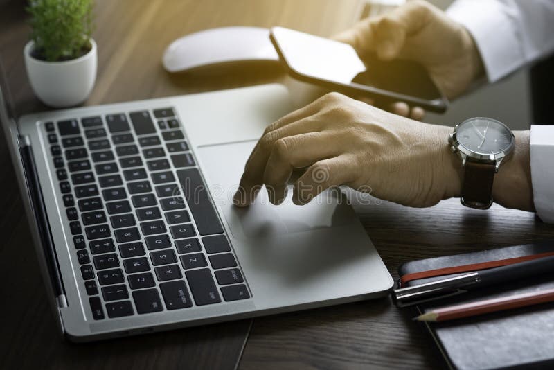Close-up of Man Hands Using and Typing Keyboard of Laptop Computer on ...