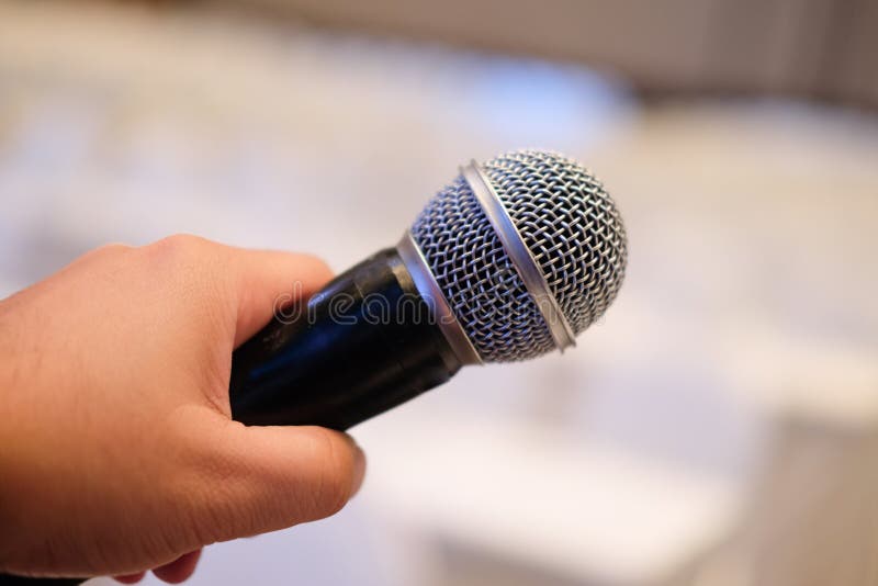 Close Up of a Man Holding Microphone Stock Image - Image of ... Close Up of a Man Holding Microphone Stock Image - Image of ...