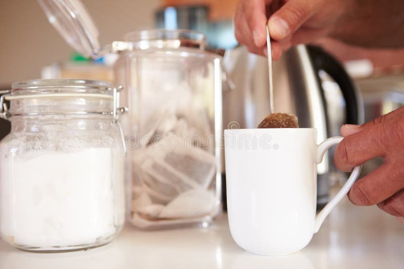 Close Up of Man Making Tea in Cup Using Teabag Stock Image - Image of ...