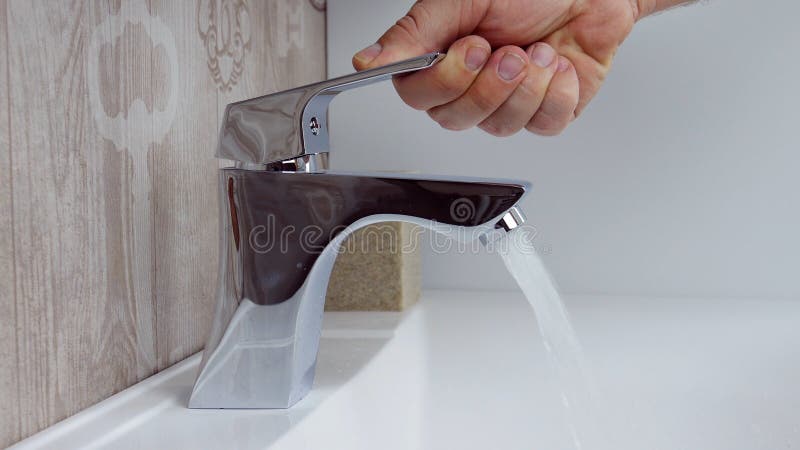 Close Up of a Man Opening Tap at the Bathroom Sink Stock Image - Image ...