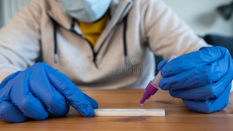 Close-up of Man Placing the Sample into a Buffer Dropper for ...