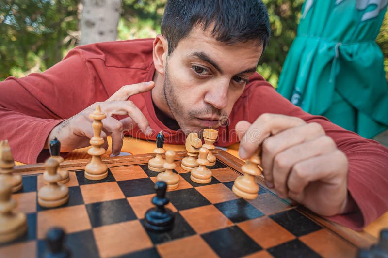 A Man is Playing Chess, Thinking about the Next Move Stock Photo ...