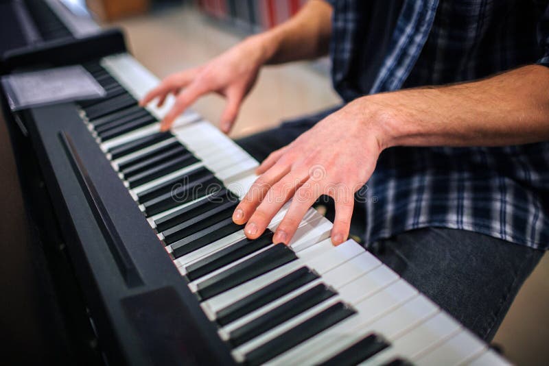 Close Up of Man Playing on Keyboard. he Sits Alone in Room. Stock Image ...