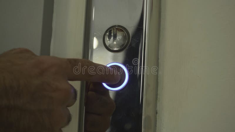 Close-up of Man Pressing Elevator Button. HDR. Reflection of Man in ...