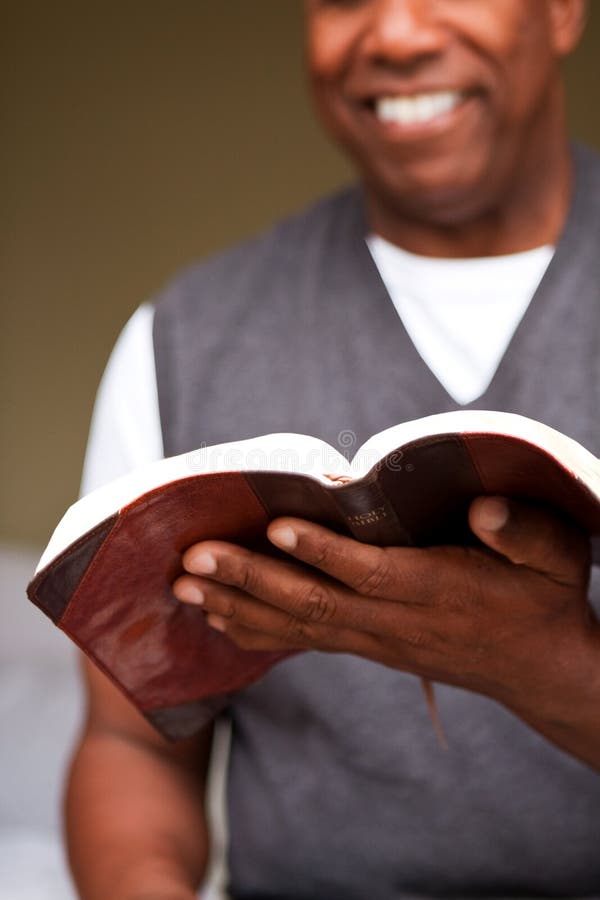 African American Man Holding Up Bible Stock Photos - Free & Royalty ...