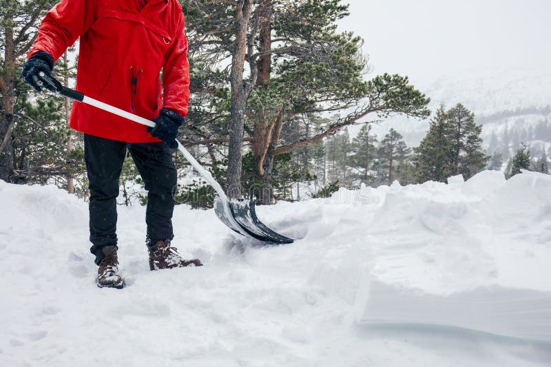 Close-up of Man in Red Coat Cleaning Thick Snow. Stock Photo - Image of ...
