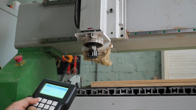 A Man with a Remote Control Turns on a Program on a Modern Laser on ...