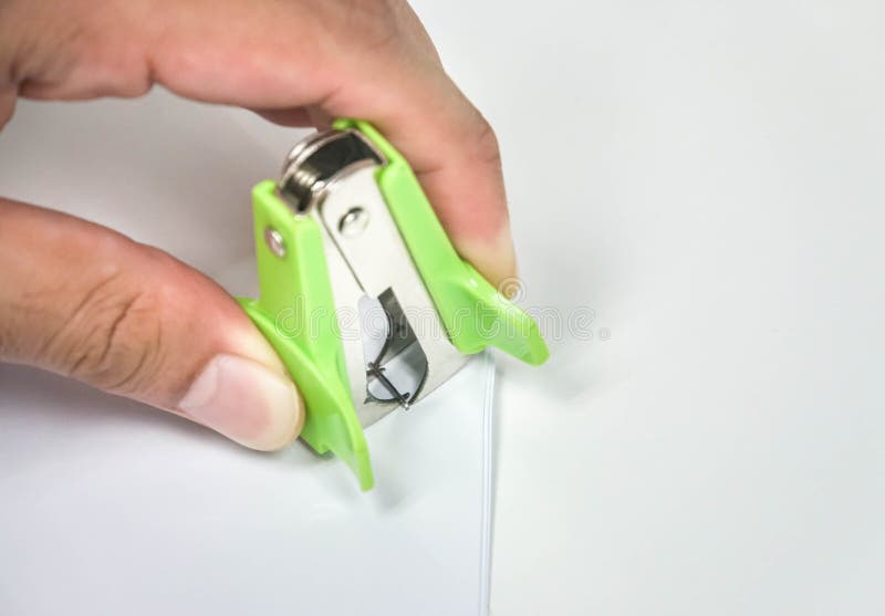 Man Hand Remove Staple from Business Documents by Staple Puller in ...