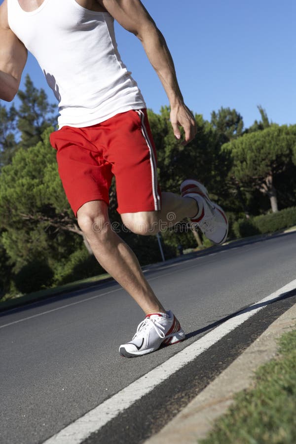 Close Up of Man Running on Road Stock Photo - Image of people, running ...