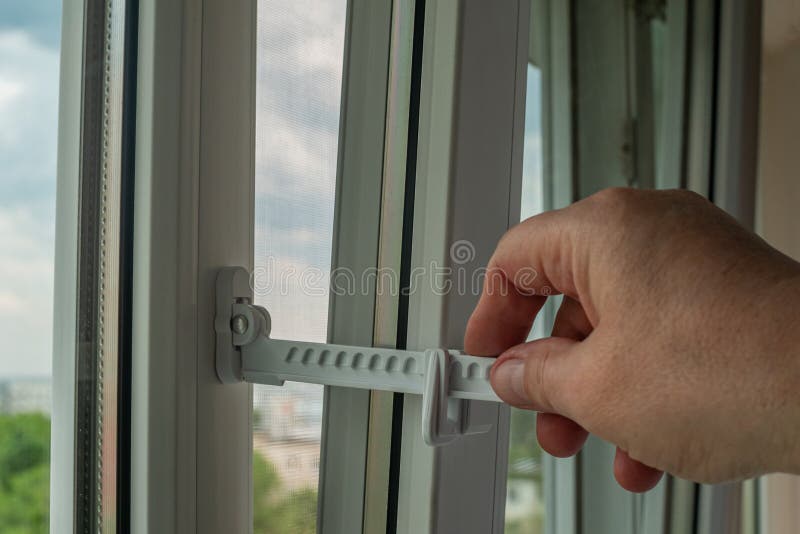 Close-up of a Man& X27;s Hand Adjusting a Window Opening Limiter ...