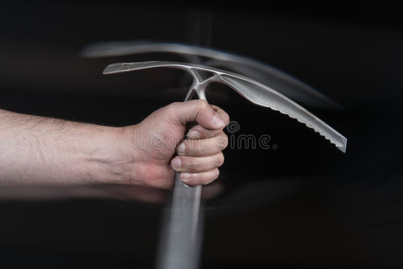 Close Up of Man S Hand Holding a Climbing Ice Axe with Motion Effect ...