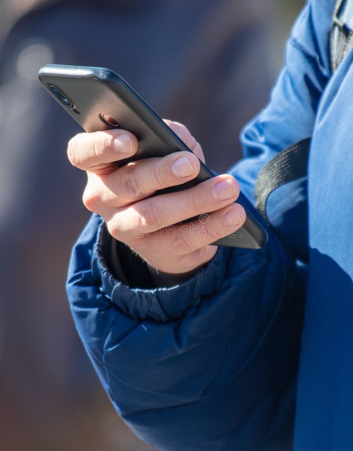 Close-up of a Man& X27;s Hand Holding a Mobile Phone Stock Photo ...