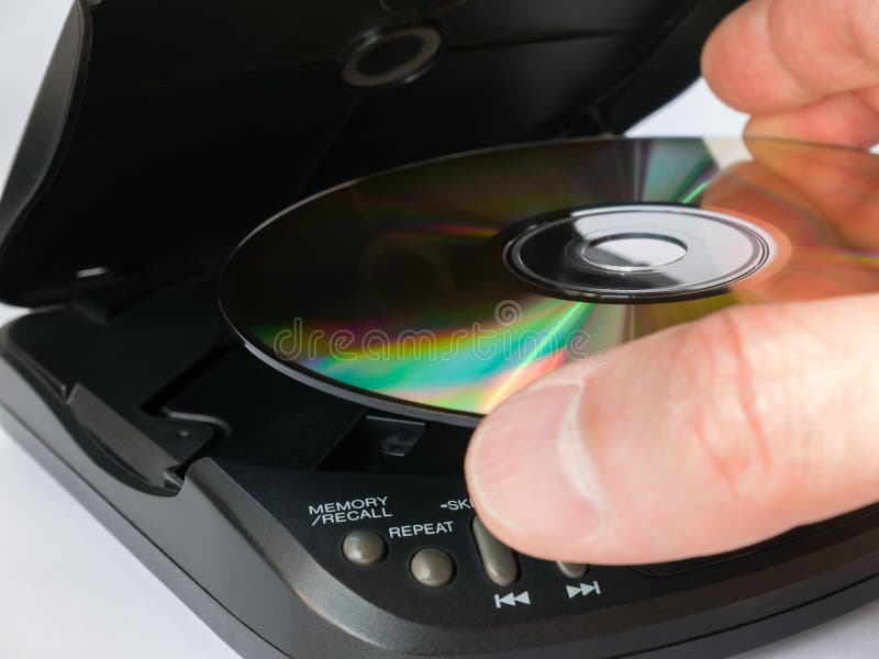 Close-up of a Man S Hand Inserting a CD into a Portable CD Player Stock ...