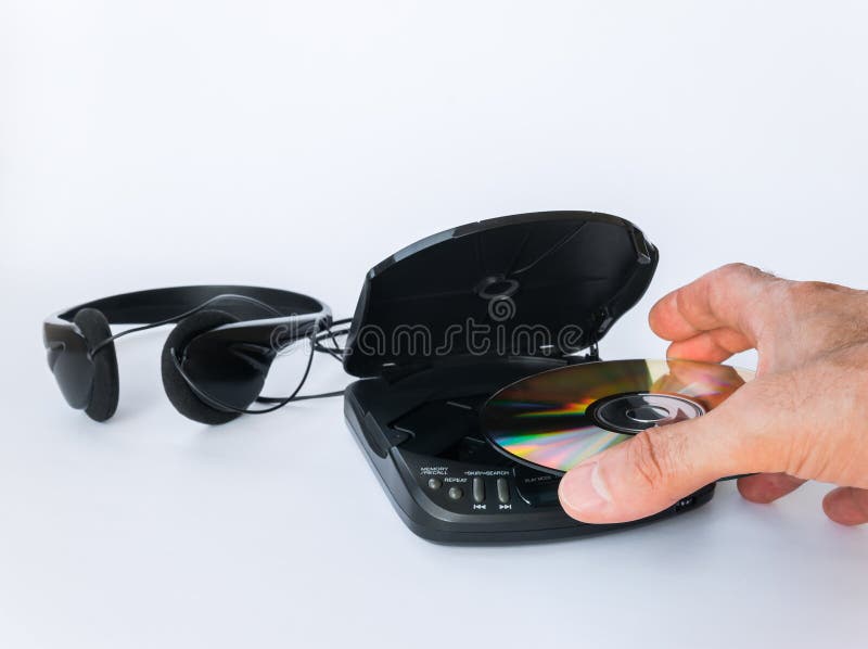 Close Up of a Man S Hand Inserting a Compact Disc into a Compact Disc ...