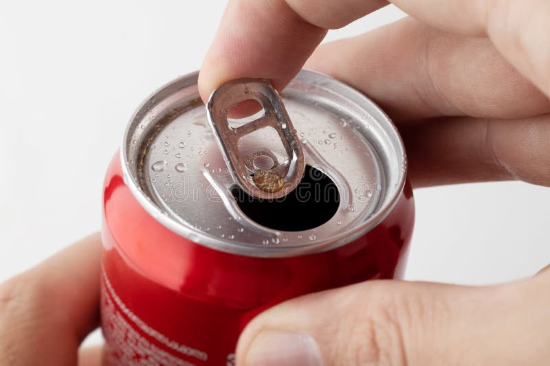 Close-up of a Man S Hand Opening a Red Can of Soda on a White ...