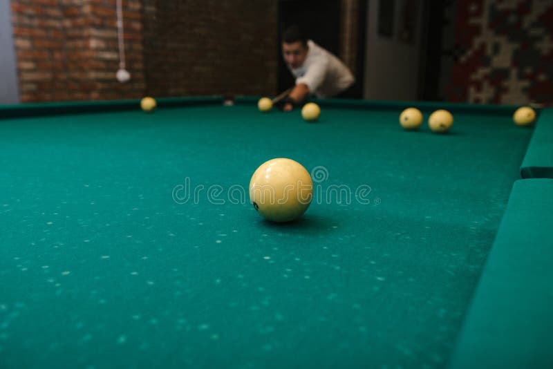 Close-up of a Man& X27;s Hand Playing Billiard on a Green Pool Table ...