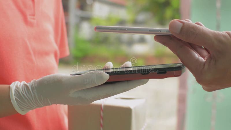 Close Up of Man`s Hand Receive a Parcel Cardboard Box from a Delivery ...