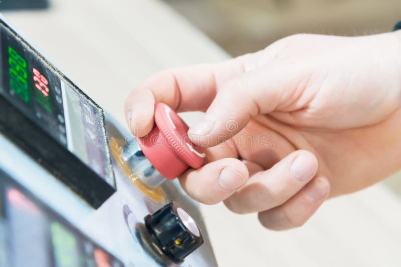 Close-up of a Man`s Hand on a Red Button on the Control Panel ...