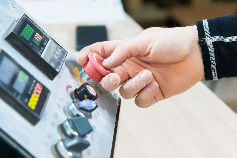 Close-up of a Man`s Hand on a Red Button on the Control Panel ...