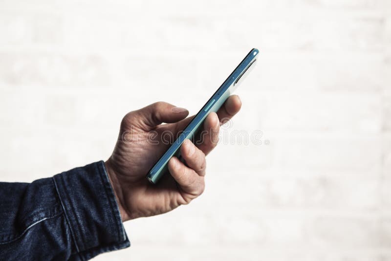 Close Up of a Man`s Hand Using a Smart Mobile Phone Stock Photo - Image ...