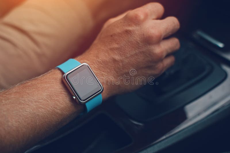 Close-up of Man`s Hand Wearing Smart Watch and Driving Car, Inside ...