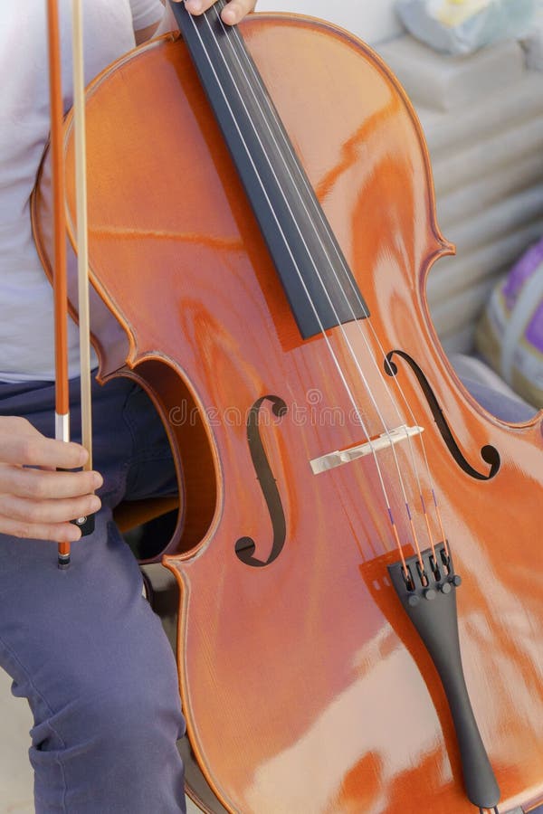 Close-up of a Man& X27;s Hands Playing the Cello Stock Image - Image of ...