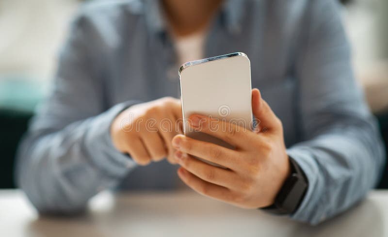 Close-up of a Man& X27;s Hands Using a Smartphone, Focusing on the ...