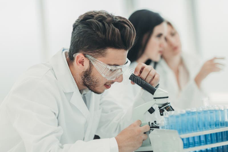 Close Up.man Scientist Looking through a Microscope Stock Photo - Image ...