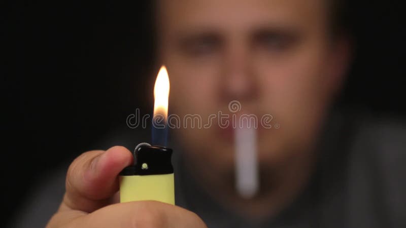 Close-up, Man Sets a Gas Lighter on Fire. Focus on the Lighter Stock ...