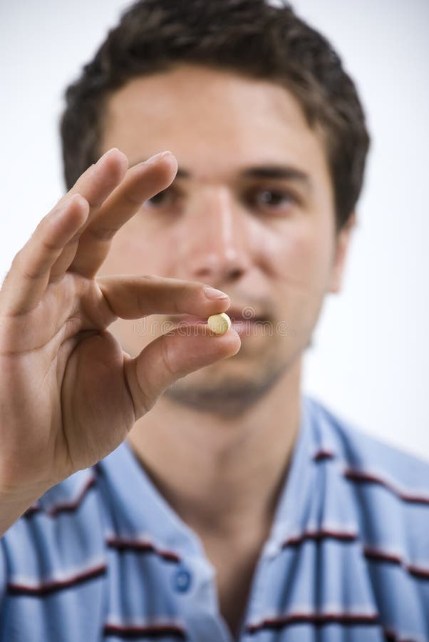 Close up man showing pill stock photo. Image of interior - 14131454