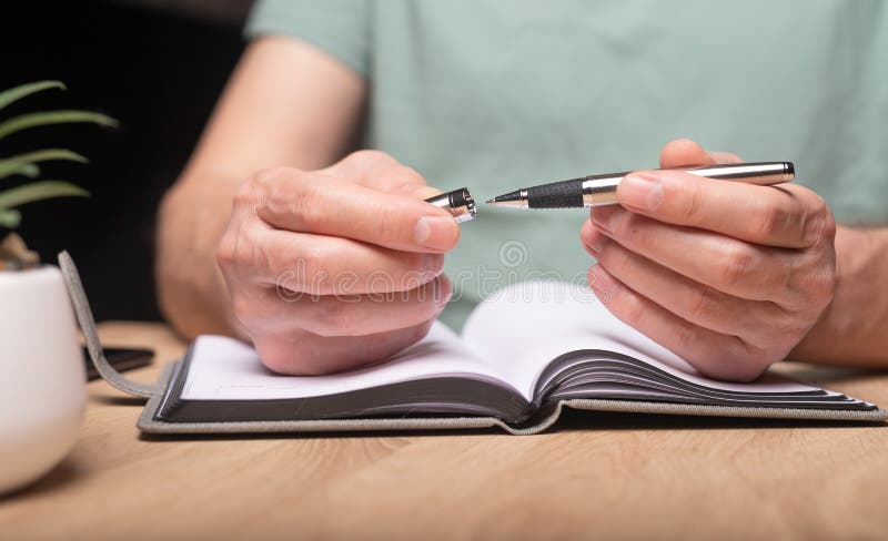 Close Up Man Taking Notes on Meeting, Ready To Write Down Schedule ...