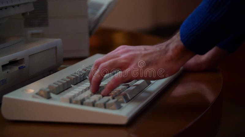 Close-up of Man Typing on Old Computer. Media. Man is Typing on Old ...