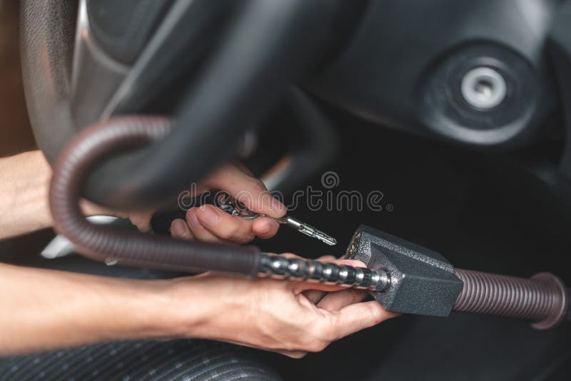 Close Up of Man Use Key Locking Steering Wheel for Security, Anti Thief ...
