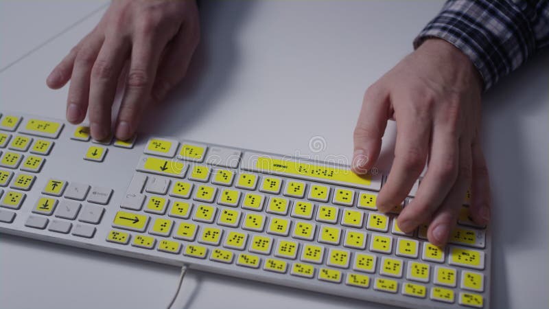 Close-up: a Man Uses a Keyboard with Braille. a Blind Man is Typing ...